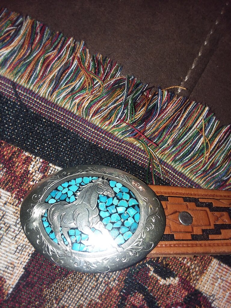 Can anyone I'd this maker mark/symbol on buckle & bolo or origin ...